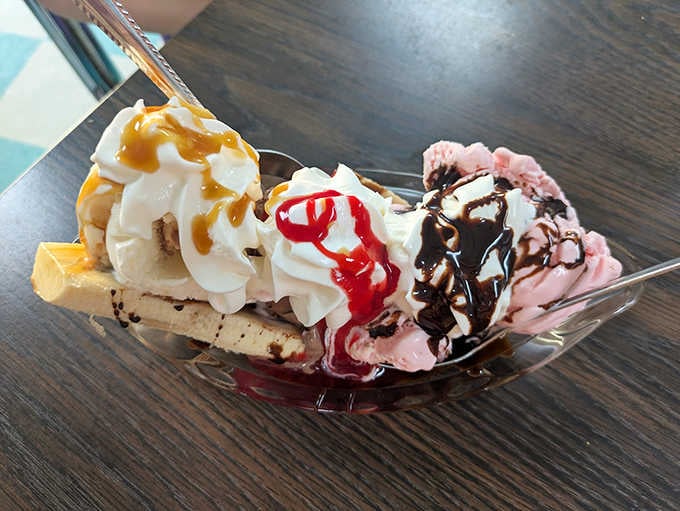 A banana split that looks like it escaped from a Norman Rockwell painting and landed on your table instead.