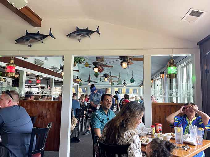 Happy diners surrounded by maritime decor, living their best waterfront lunch life one bite at a time.