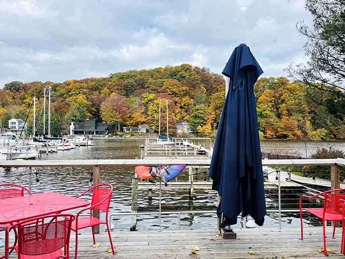 The marina view offers peaceful waterfront scenery with sailboats bobbing gently&mdash;a perfect Michigan backdrop for dining.