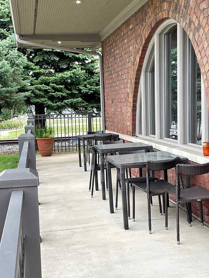 Outdoor patio seating under those original depot eaves lets you enjoy breakfast while imagining trains pulling up beside you.