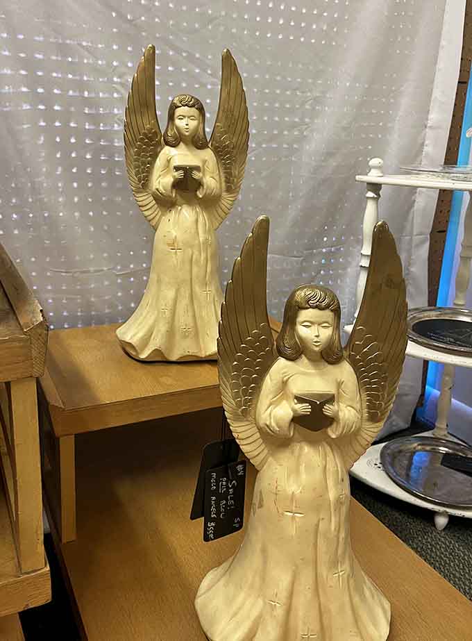 Angel figurines standing guard over treasures, like heavenly bouncers for your vintage shopping experience.