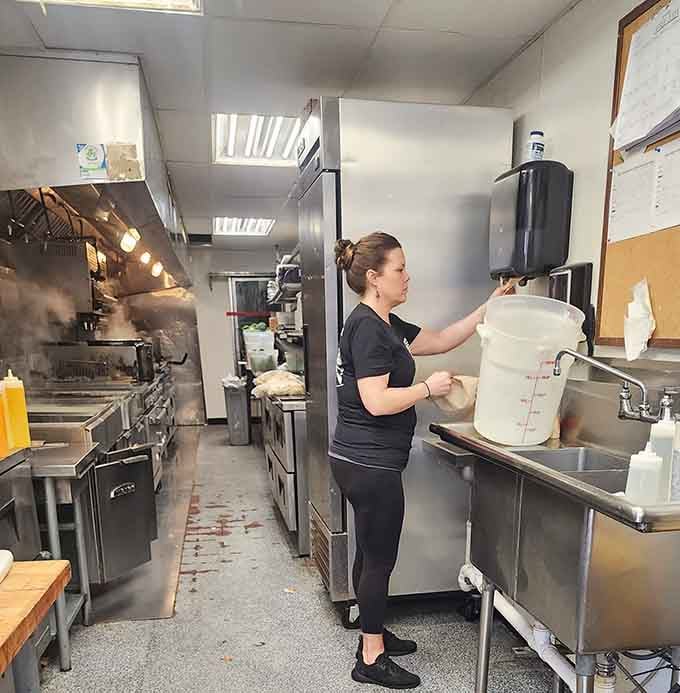 Behind the scenes, the kitchen crew works their magic, turning quality beef into culinary gold.