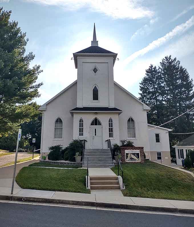 This classic white church embodies the architectural simplicity that makes small-town America feel like coming home.