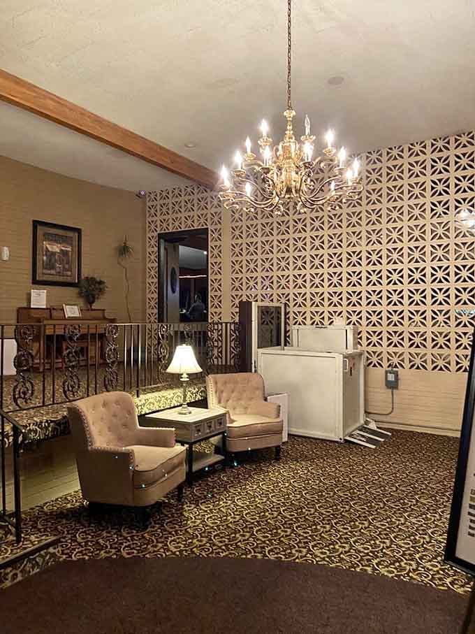 That chandelier and those vintage chairs in the lobby set the tone before you even sit down to eat.
