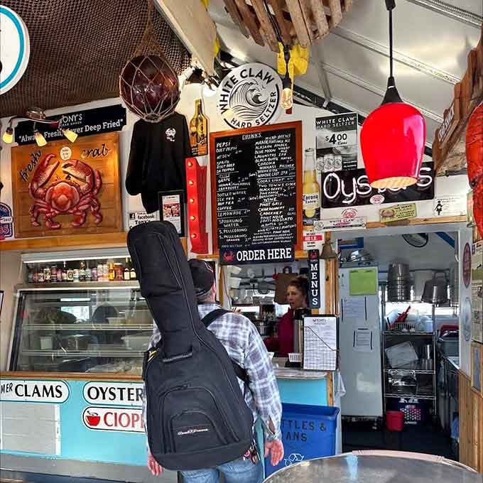 The order window where magic happens and your seafood dreams transform into delicious reality moments later.