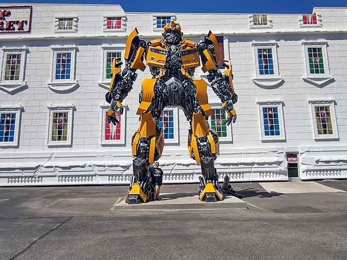 Bumblebee towers over visitors, proving that even Autobots appreciate a good roadside attraction photo op.