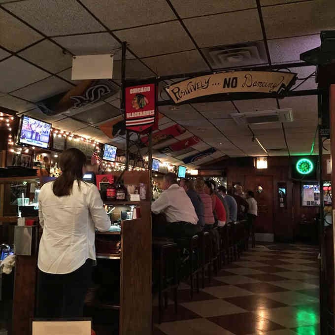 Vintage signs and memorabilia cover the walls, each piece adding another layer to this tavern's rich history.