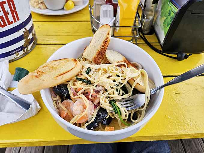 Seafood pasta loaded with shrimp and mussels proves carbs and ocean bounty make beautiful music together always.