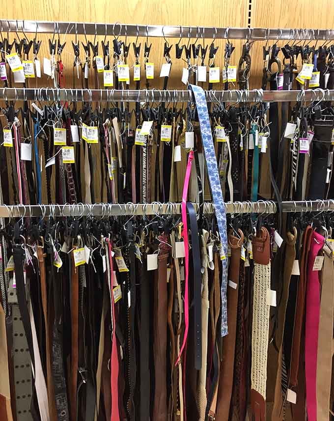 Belts hang organized by color and style, ready to hold up your pants and your reputation as a savvy shopper.