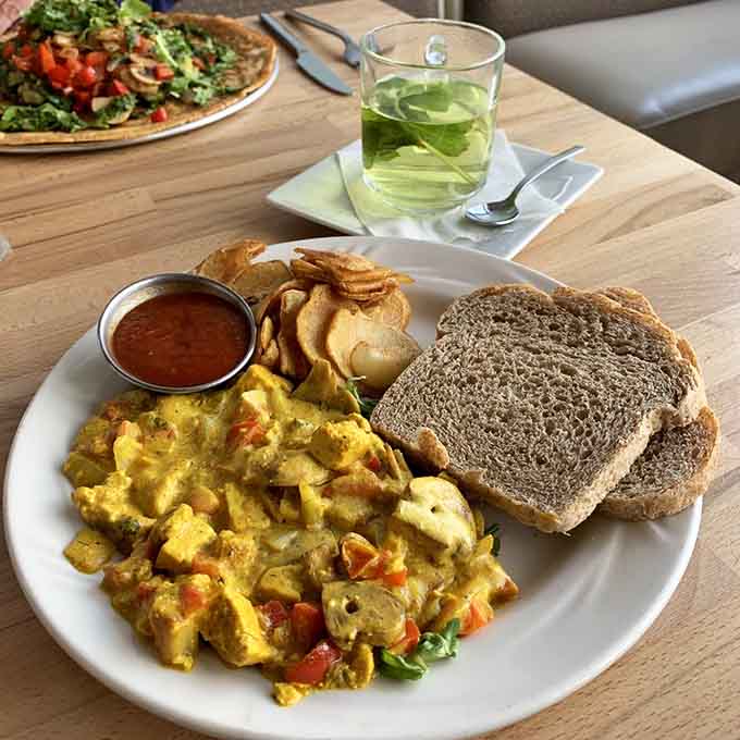 Tofu scramble with toast and home fries shows that Dutch-inspired breakfast can be both hearty and completely plant-based without compromise.
