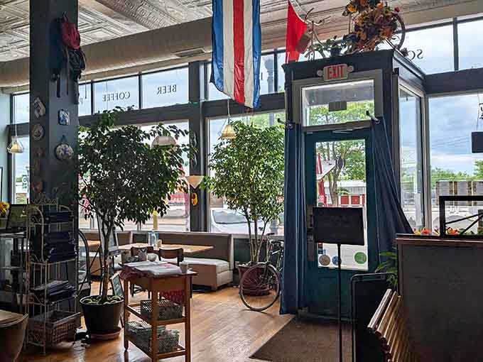 Even the exit view reveals thoughtful European touches, from potted plants to that charming tin ceiling overhead.