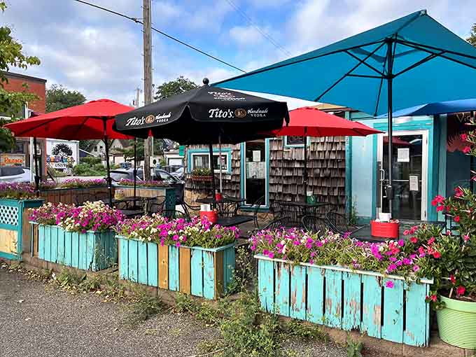 Even the outdoor patio embraces that vibrant turquoise theme, creating a cheerful oasis along bustling Nicollet Avenue year-round.