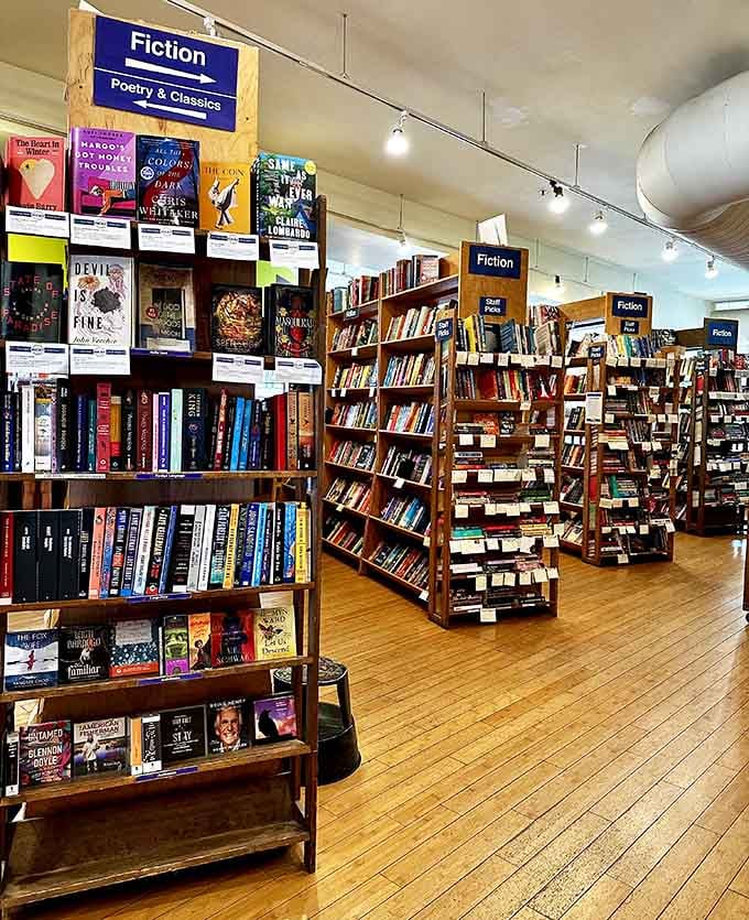 Village Books and Paper Dreams fiction bookshelves stretch endlessly with staff picks helping navigate thousands of compelling titles.