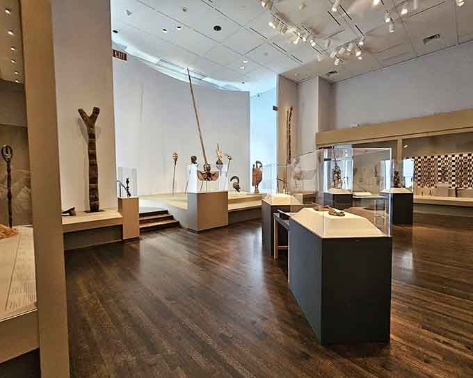 African artifacts displayed with the reverence they deserve, telling stories that span continents and centuries without saying a word.