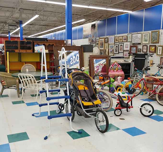 When furniture, bikes, and framed art collide in one glorious corner, you know you've found thrift store nirvana.