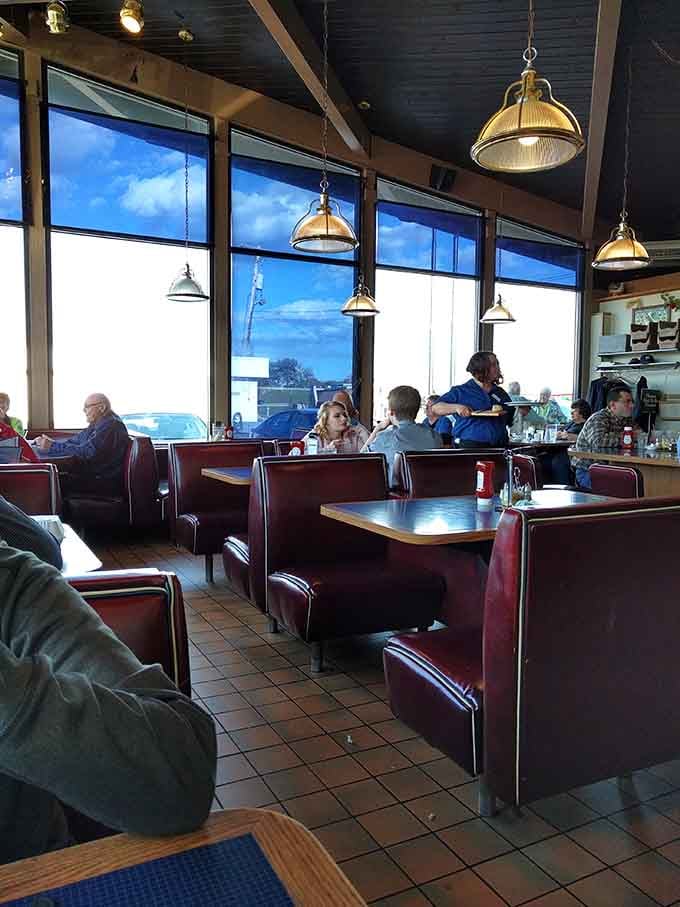 Burgundy vinyl booths and pendant lights create that authentic diner atmosphere money can't buy, only time can create perfectly.