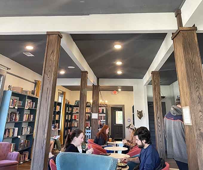 Real people actually reading real books while enjoying real wine, not just posing for social media photos.