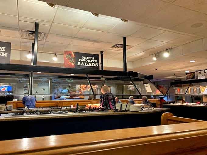 The salad bar station where fresh ingredients await your creative plate-building skills.