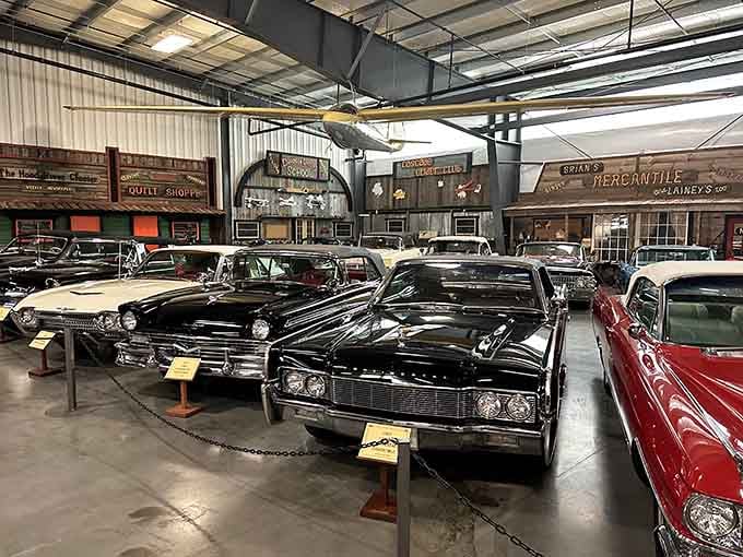 These vintage automobiles against old-timey storefronts create the ultimate nostalgic backdrop for mechanical marvels.