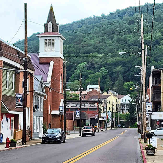 Main Street stretches through town, church steeples rising above buildings that have weathered decades with quiet grace and dignity.