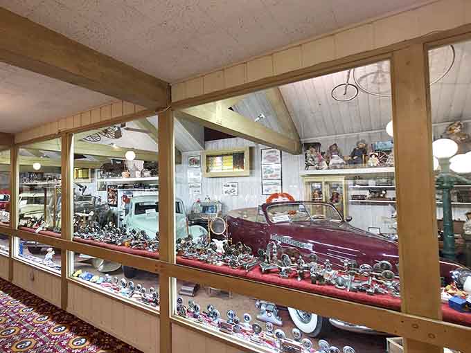 A vintage car display in the gift shop area, because nothing says "farm restaurant" quite like classic automobiles.