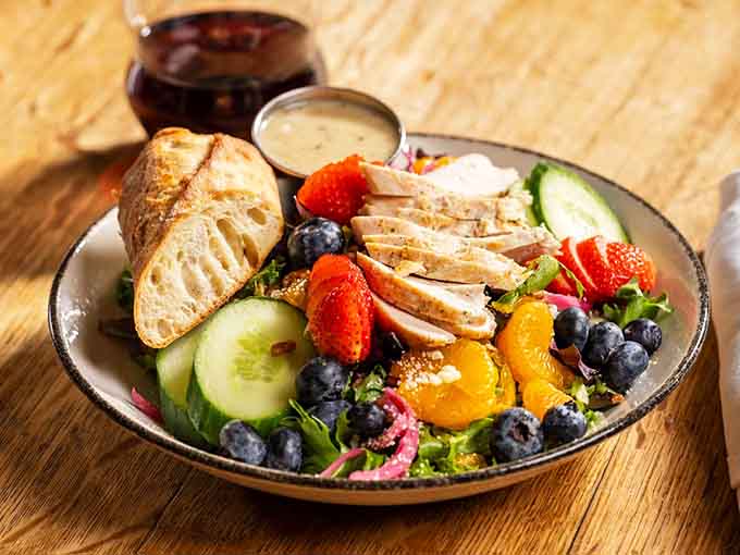 Warm grilled chicken salad loaded with fresh fruit proves healthy eating doesn't mean sacrificing flavor or satisfaction.