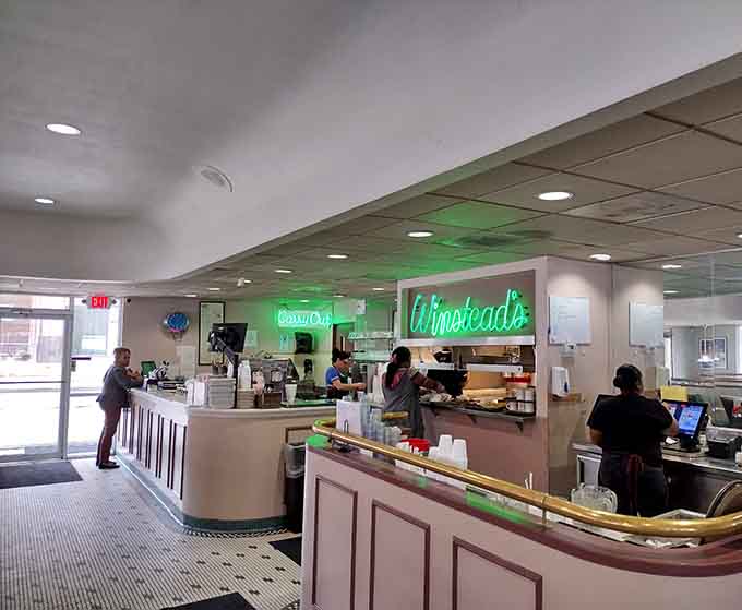 The friendly staff keeping the Winstead's tradition alive, one perfectly griddled steakburger at a time, with genuine Kansas City hospitality.