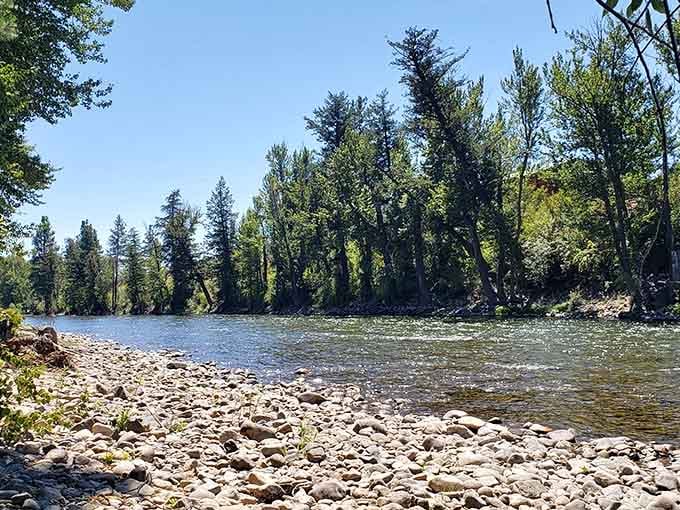 The rocky riverbank invites you to sit, skip stones, and contemplate why you don't spend more time near moving water.