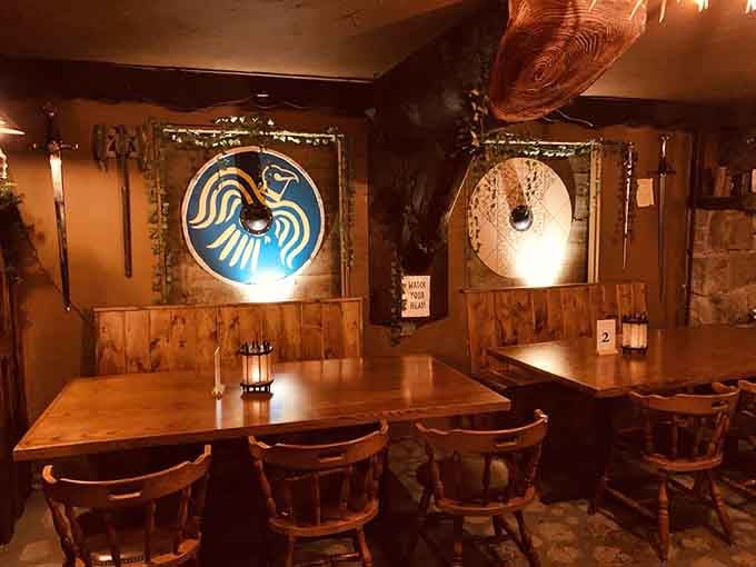 Shields on the walls and intimate seating create the perfect spot for plotting your next quest.