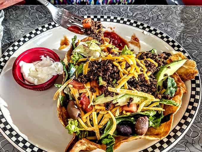 Taco salad in a crispy shell brings Tex-Mex flair to classic diner territory, proving fusion worked before it was trendy.