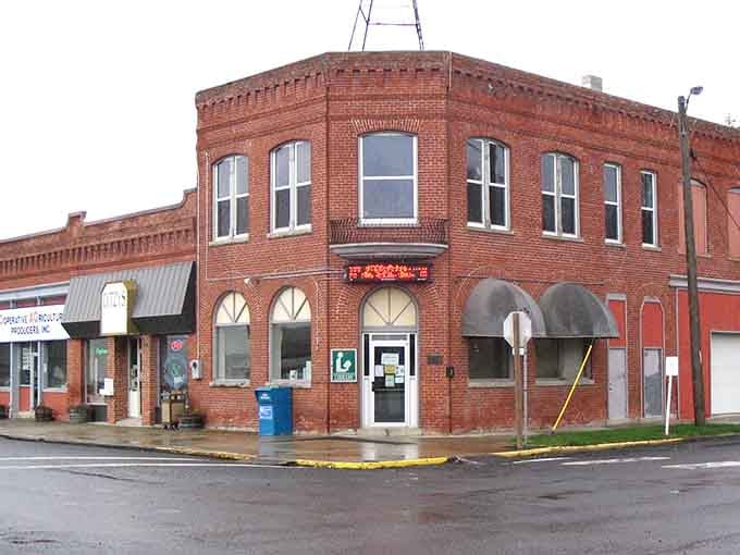 Rounded brick corner building stands like a sentinel guarding Main Street memories from the days when Eisenhower was president.