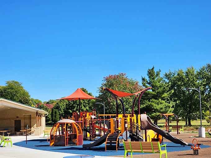 McIntosh Park's playground equipment gleams under blue skies, offering families free fun in a town that values community.