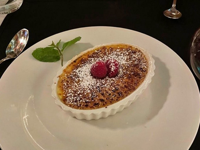 Crème brûlée with that perfect caramelized top that cracks just right, ending your meal on the sweetest possible note.
