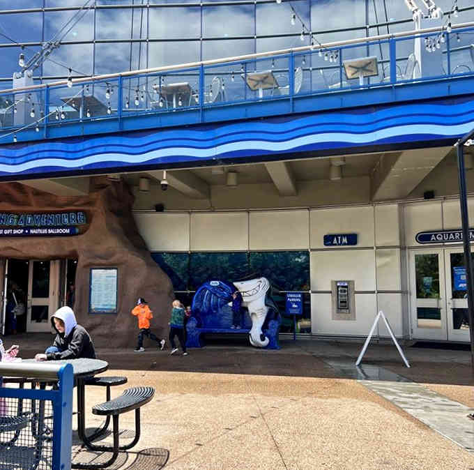 The exterior entrance features playful ocean-themed decorations that hint at the underwater world waiting inside.