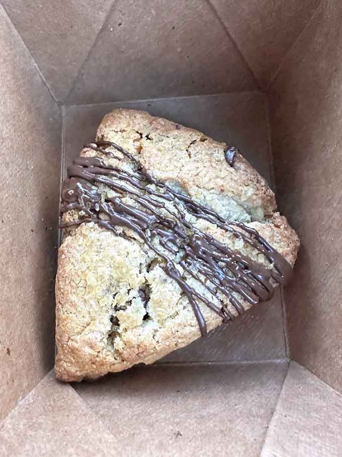 A chocolate-drizzled scone that makes you wonder why every baked good doesn't get this fancy treatment always.