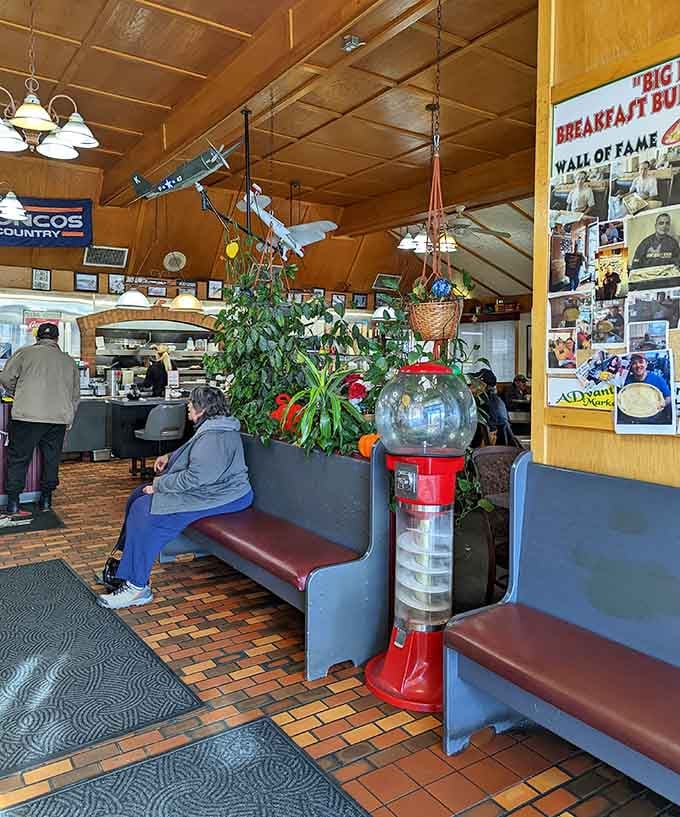The waiting area features local pride and plenty of plants—a cozy spot before the feast begins.