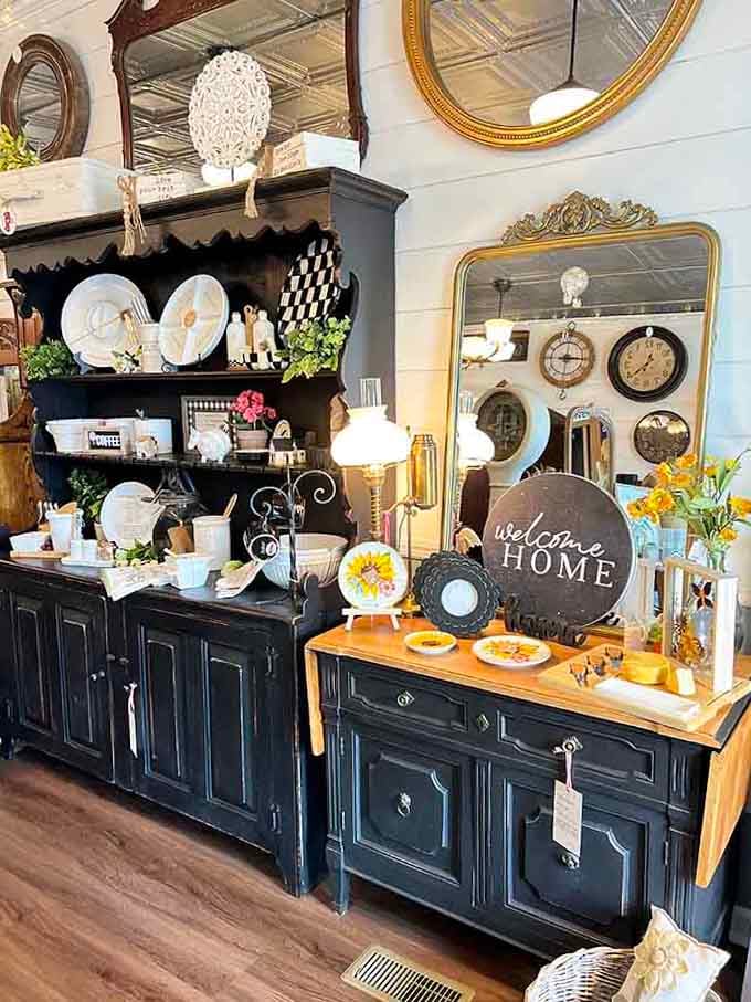 Black cabinets showcase white dishware in a display that would make any designer swoon.