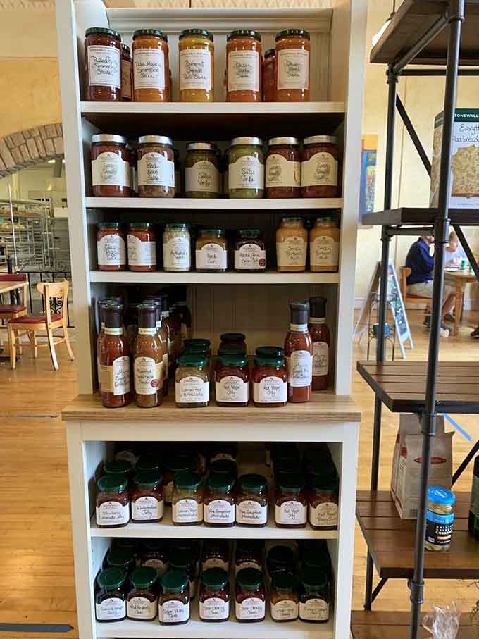 Homemade jams lined up like soldiers, ready to make your morning toast infinitely better than it deserves.