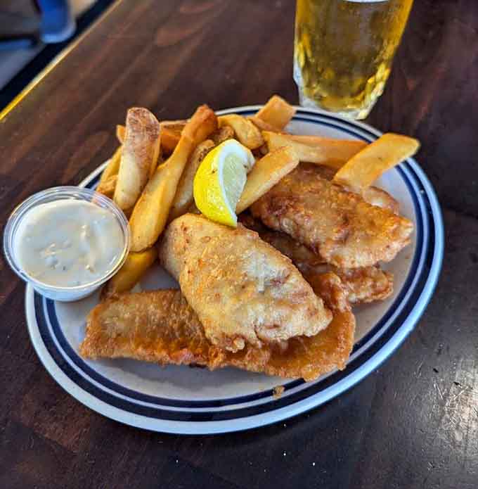 Perfectly fried fish with golden fries and tartar sauce, the holy trinity of coastal comfort food done right.