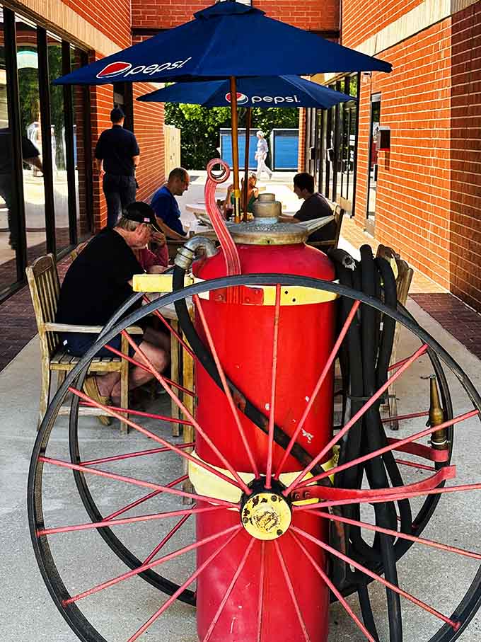 Even the outdoor seating embraces the theme with fire hose tables that are pure Instagram gold.
