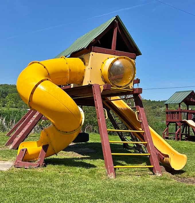 This playground with its yellow tube slide promises thrills for kids and mild anxiety for watching parents below.