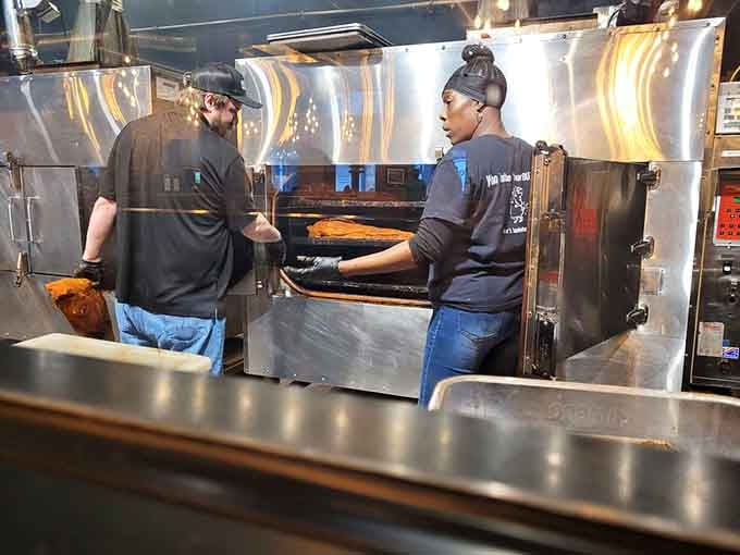 Behind the scenes, dedicated pit masters tend to smokers with the focus of surgeons, creating tender barbecue masterpieces.