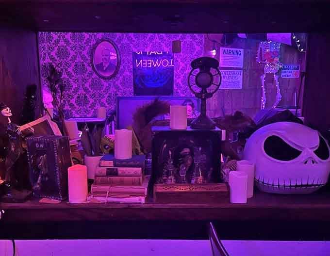 Purple lighting transforms the dining room into something between a dream and a beautifully strange reality.