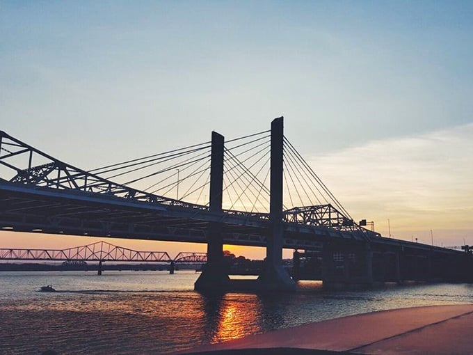 Sunset over the Ohio River bridges creates the kind of view that makes you forget to check your phone for once.