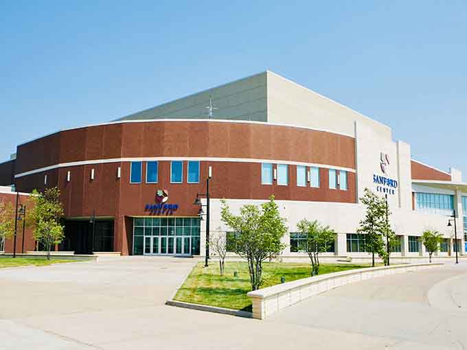 The Sanford Center's sweeping curves house hockey games, concerts, and community gatherings under one impressive modern roof.