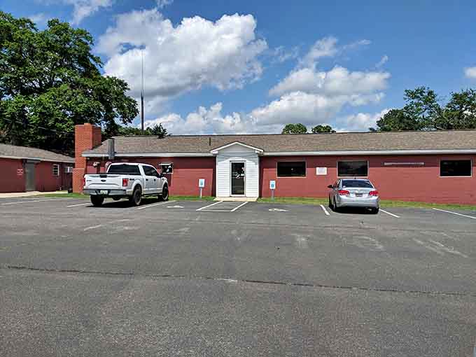 Unassuming exterior hides the kind of authentic barbecue joint where locals have been gathering for generations of finger-licking good times.
