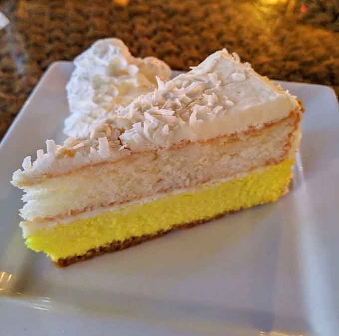 Passion fruit cheesecake layered like a sunset – sweet, tropical, and absolutely worth saving room for.