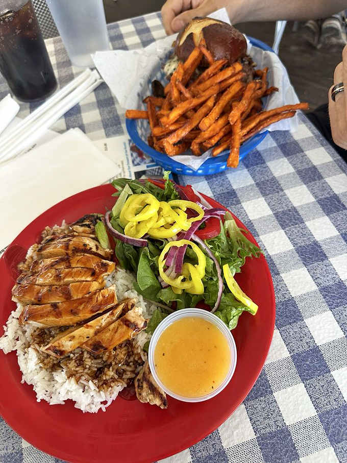 Teriyaki chicken over rice with sweet chili fries, because Bill's Grill knows burgers aren't the only path to happiness.
