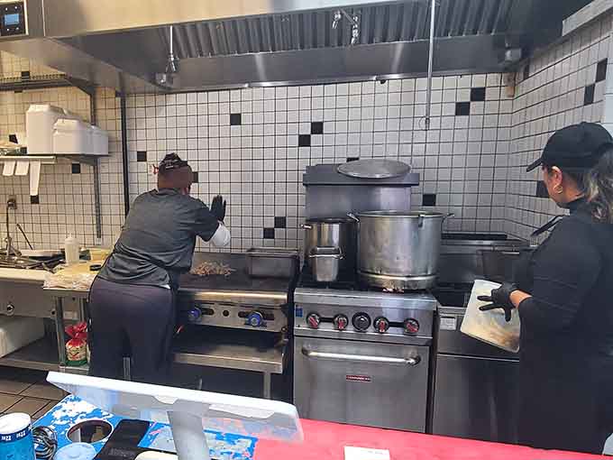Behind the scenes, the kitchen crew works their magic, turning quality ingredients into the birria everyone's talking about.