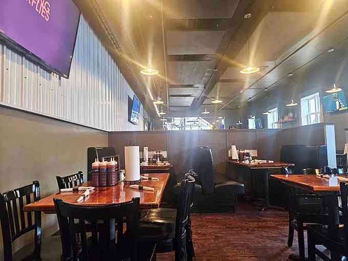 Booth seating and warm lighting create an atmosphere where serious eating happens without any stuffiness or pretension.